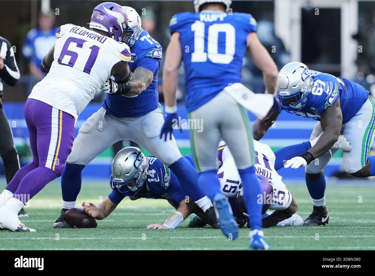 Seattle Seahawks quarterback Sam Darnold (14) loses the football on a ...