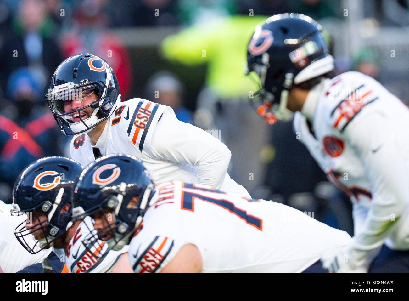 Chicago Bears quarterback Caleb Williams, top left, calls out the play ...