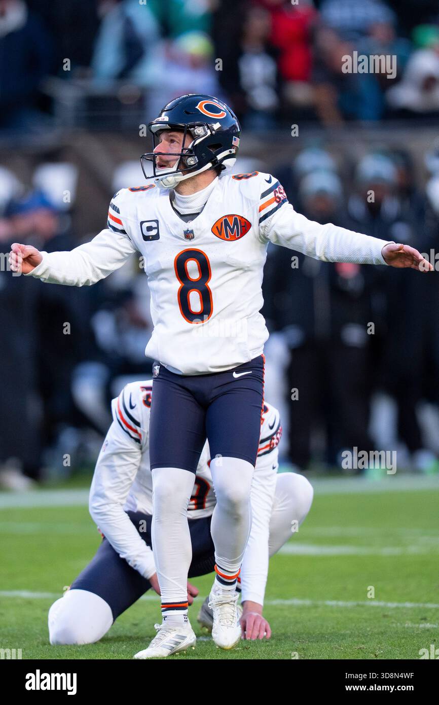 Chicago Bears kicker Cairo Santos, right, kicks the extra point with ...
