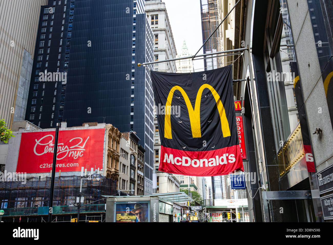New-York, USA - 21.11.2025: A McDonald's branch with its flag flying on ...