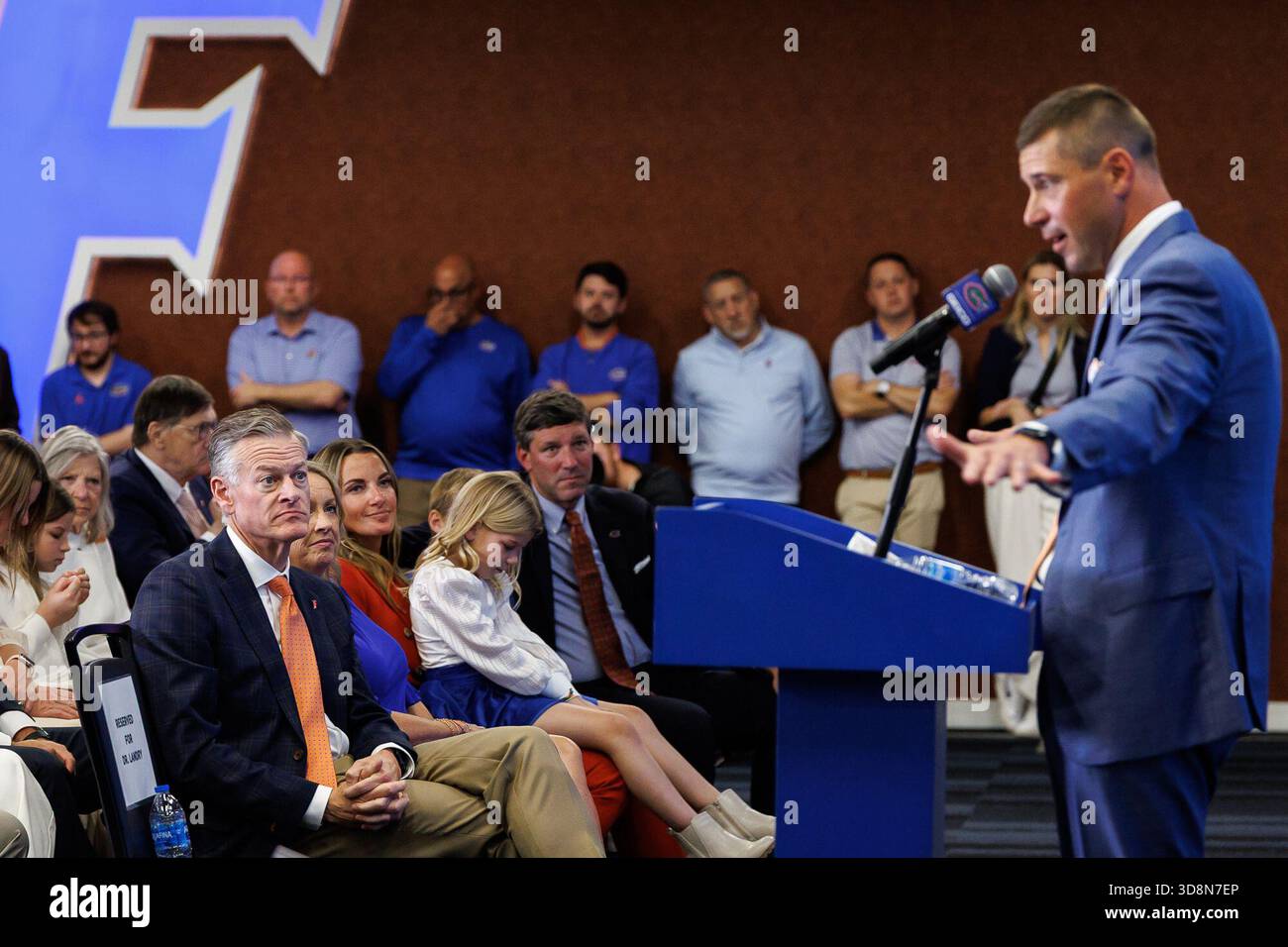 Florida athletics director Scott Strickland, left, watches as new ...