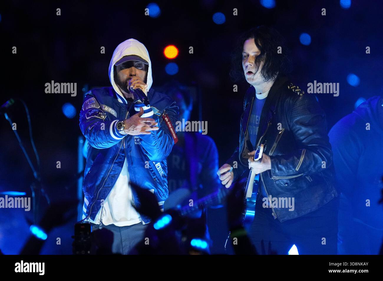 Eminem performs with Jack White during an NFL football game between the ...