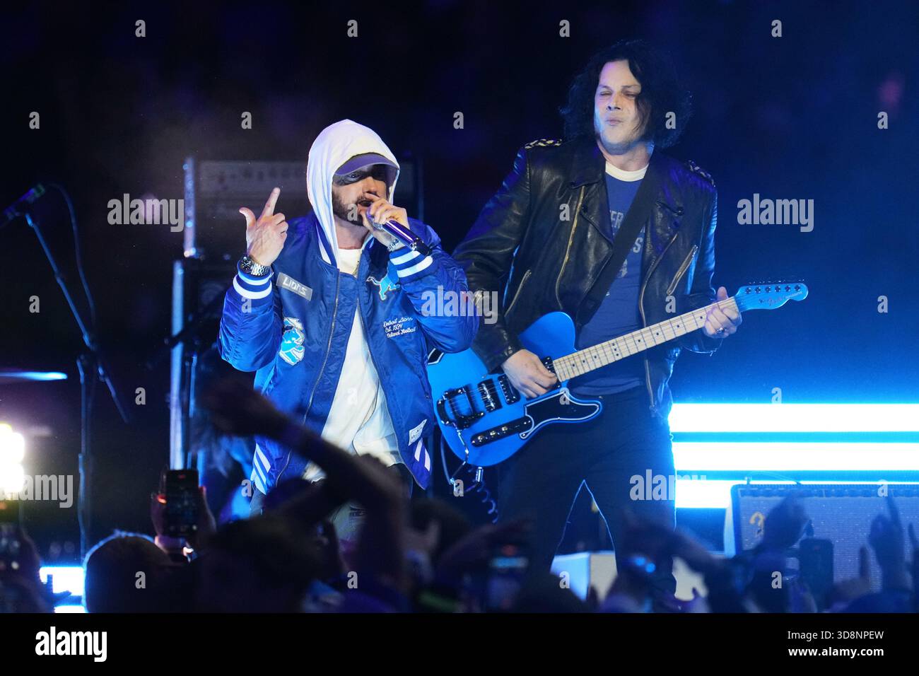 Eminem performs with Jack White during an NFL football game between the ...