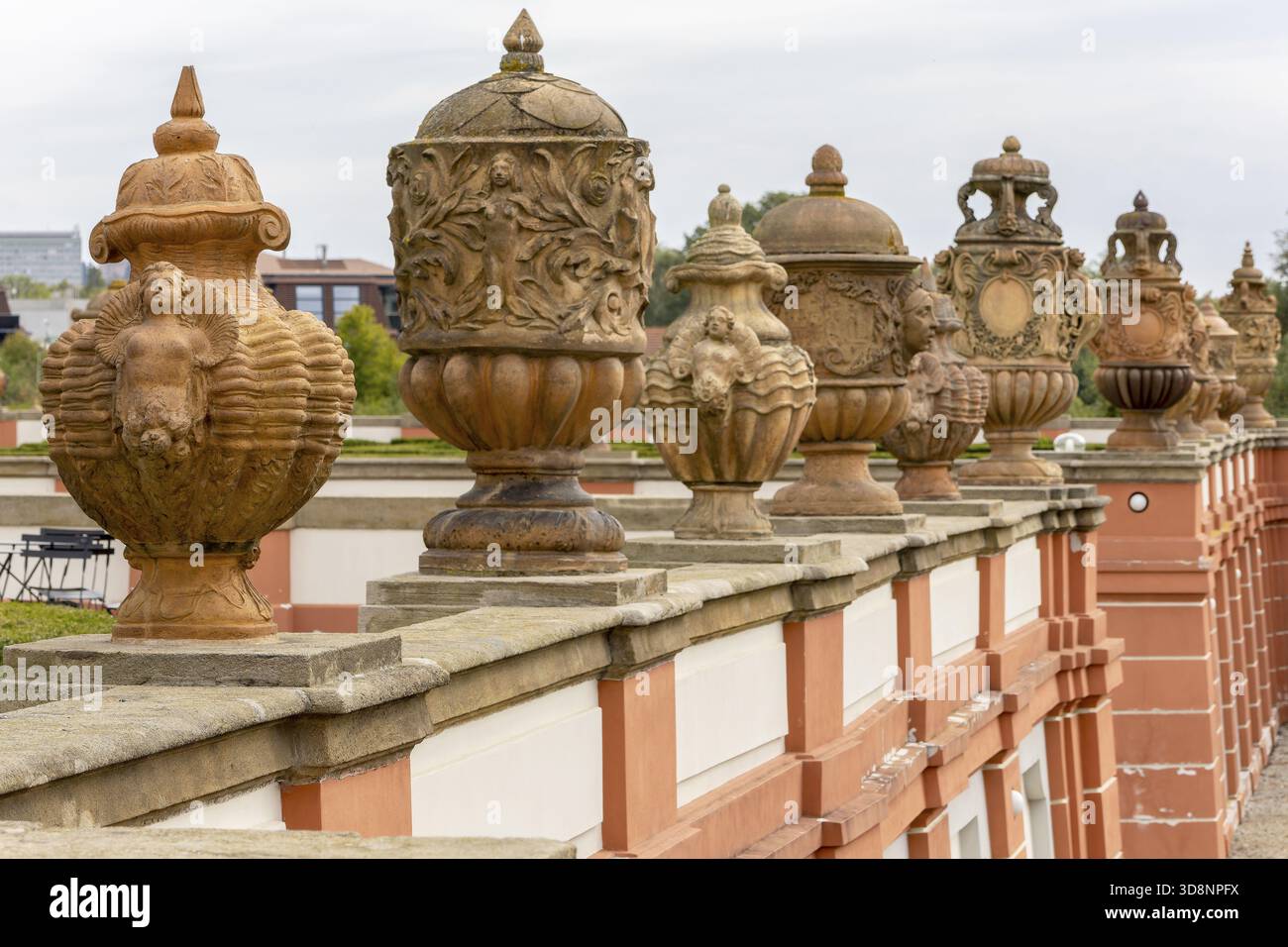 Clay sculptures on the garden wall of the baroque Troy Castle, Troy ...