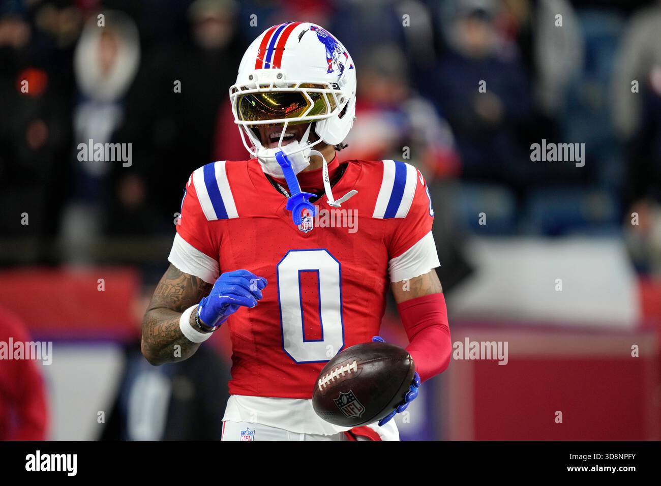 New England Patriots cornerback Christian Gonzalez warms up against the ...
