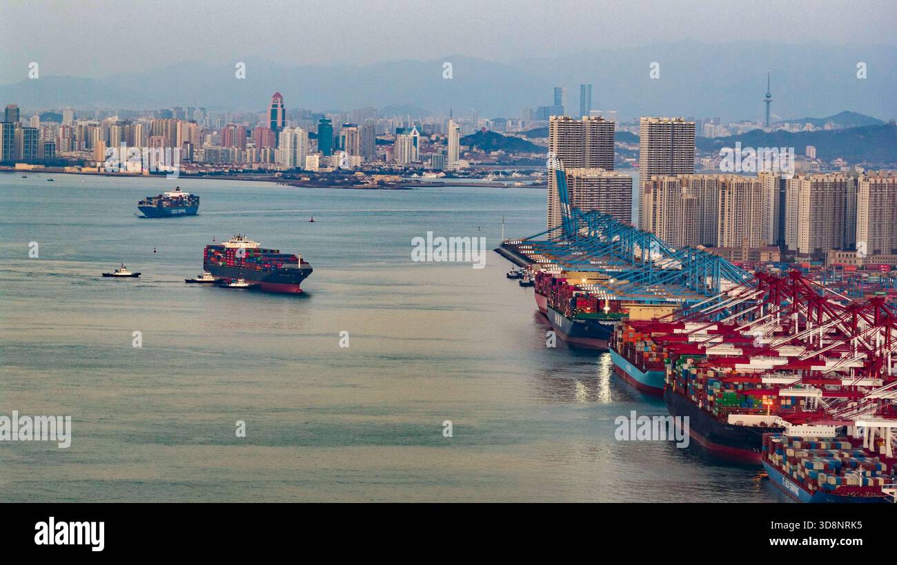 QINGDAO, CHINA - DECEMBER 1, 2025 - A cargo ship loaded with containers ...