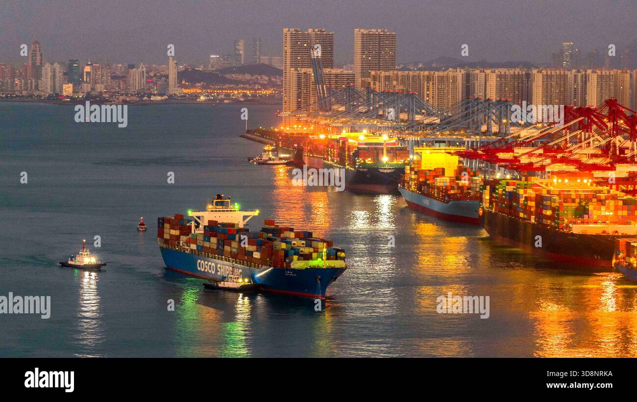 QINGDAO, CHINA - DECEMBER 1, 2025 - A cargo ship loaded with containers ...