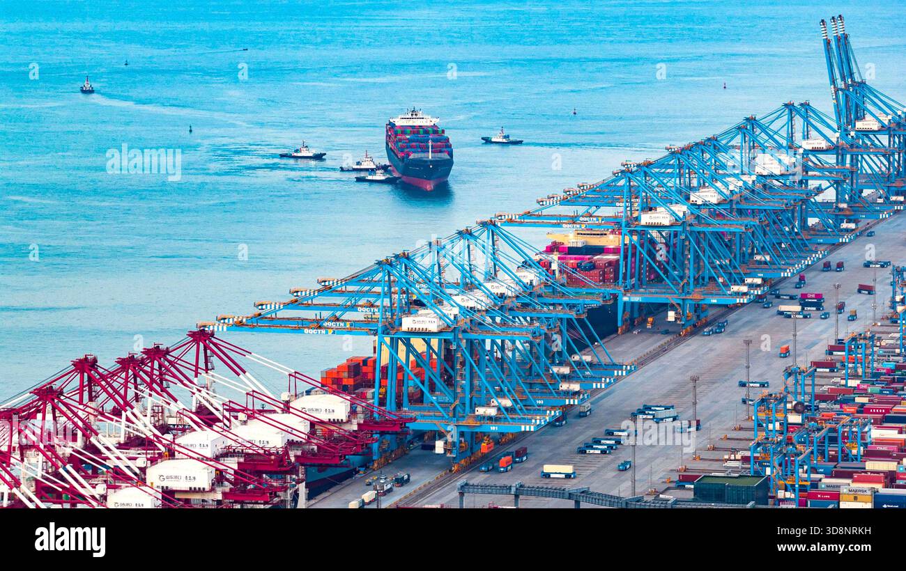 QINGDAO, CHINA - DECEMBER 1, 2025 - A cargo ship loaded with containers ...