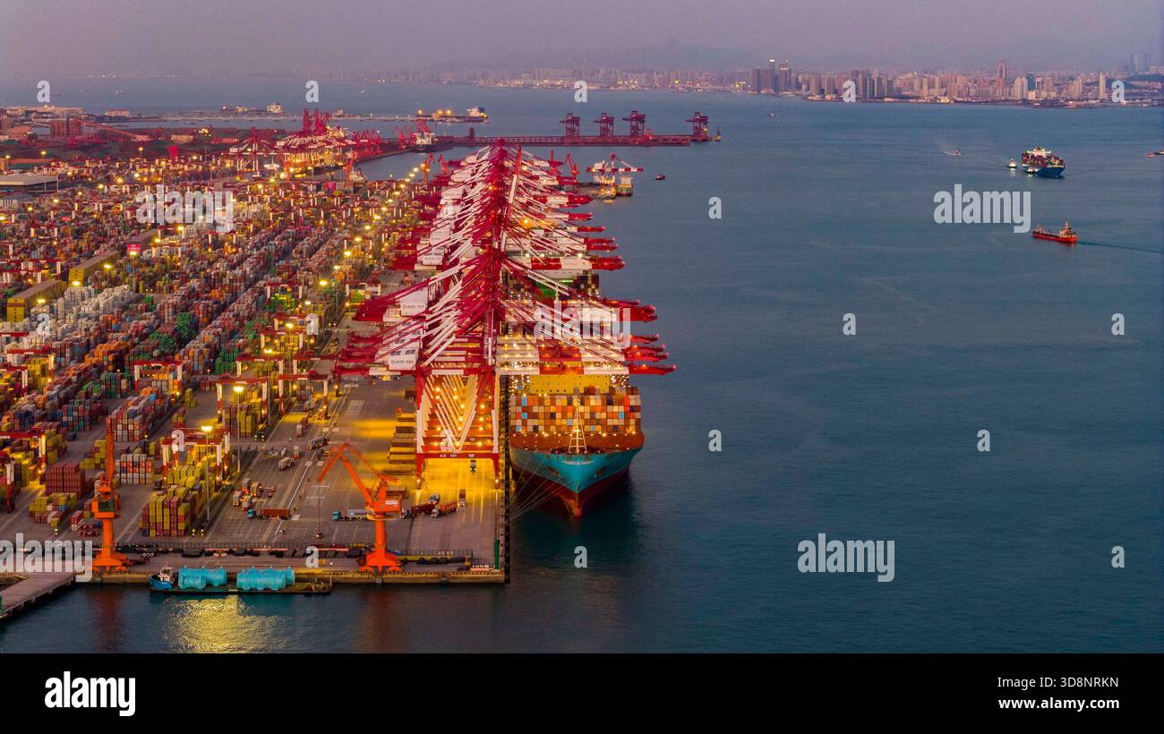 QINGDAO, CHINA - DECEMBER 1, 2025 - The cargo ship is loading and ...