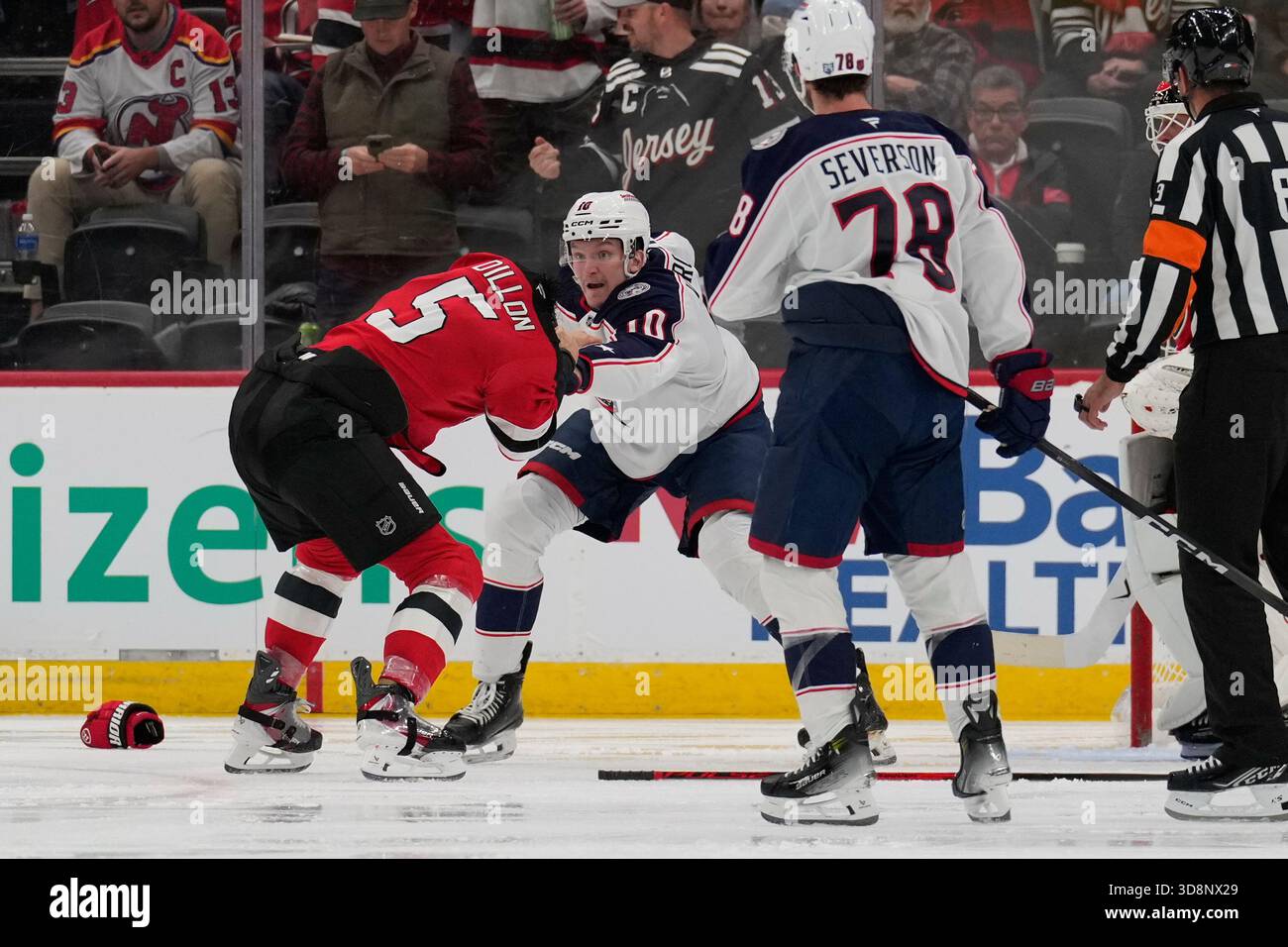 New Jersey Devils' Brenden Dillon, left, fights Columbus Blue Jackets ...