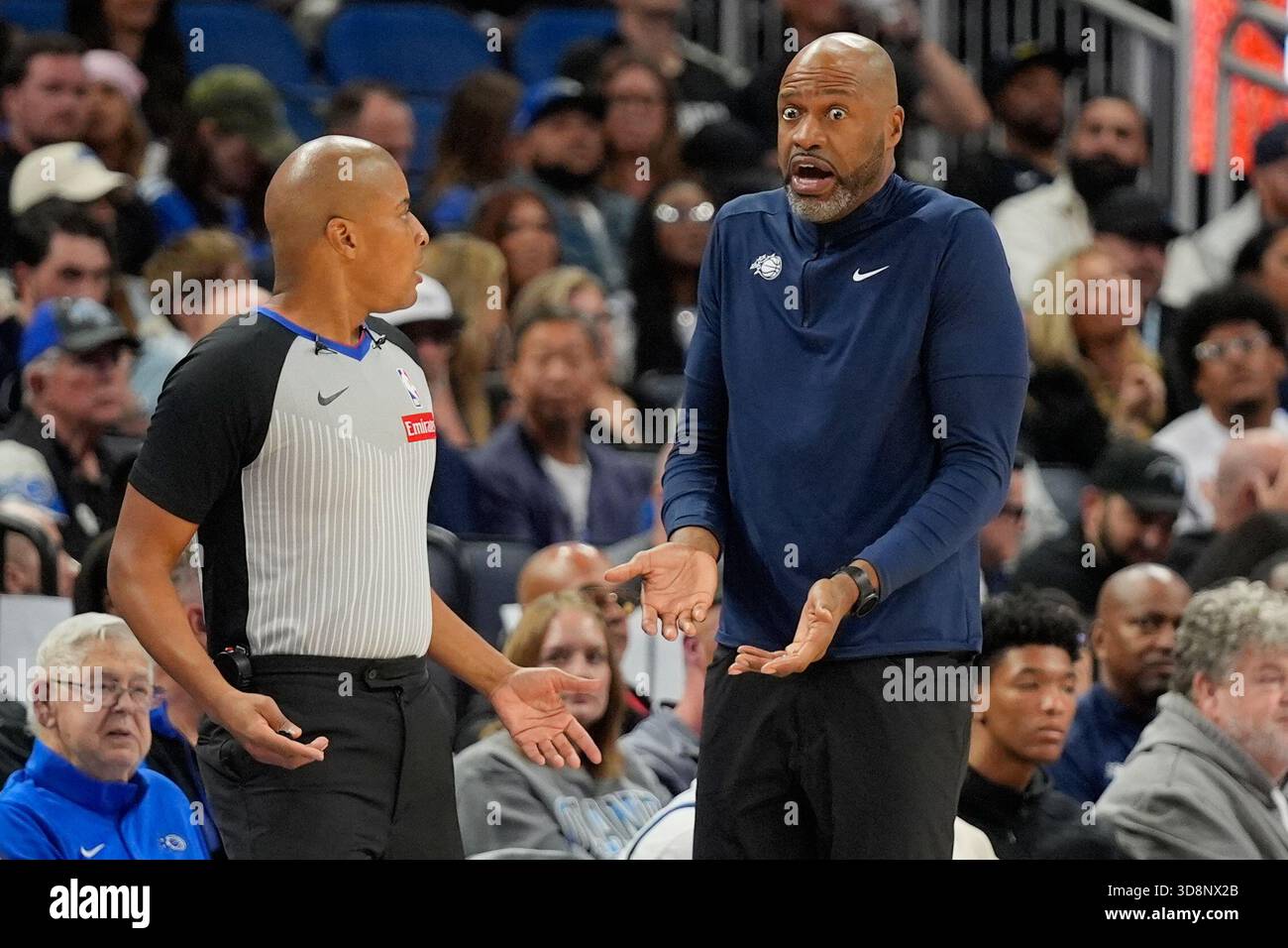 Orlando Magic head coach Jamahl Mosley, right, has words with official ...