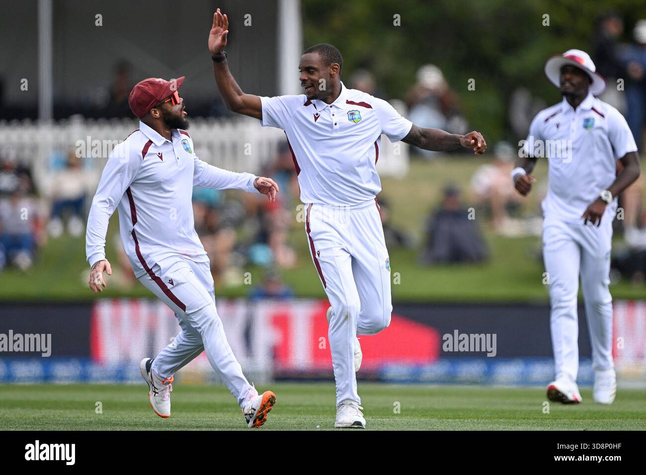 West Indies' Justin Greaves, center, celebrates with teammate John ...