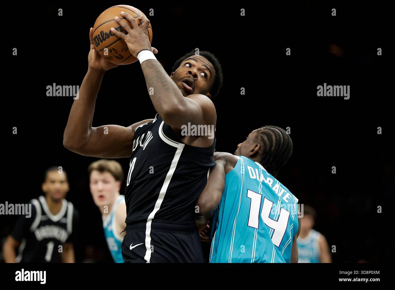 Brooklyn Nets center Day'Ron Sharpe, left, drives past Charlotte ...