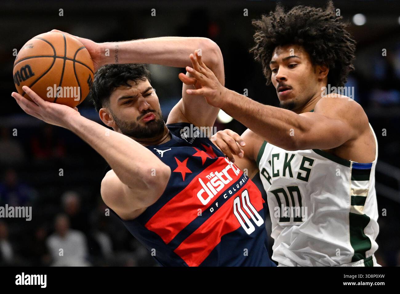 Washington Wizards forward Tristan Vukcevic, left, pulls down a rebound ...