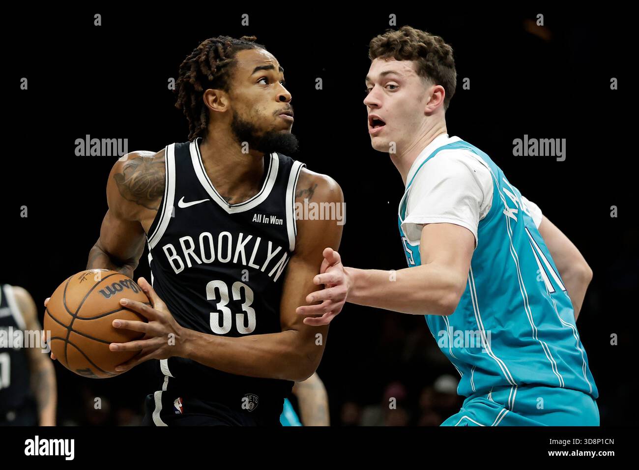 Brooklyn Nets center Nic Claxton (33) drives past Charlotte Hornets ...
