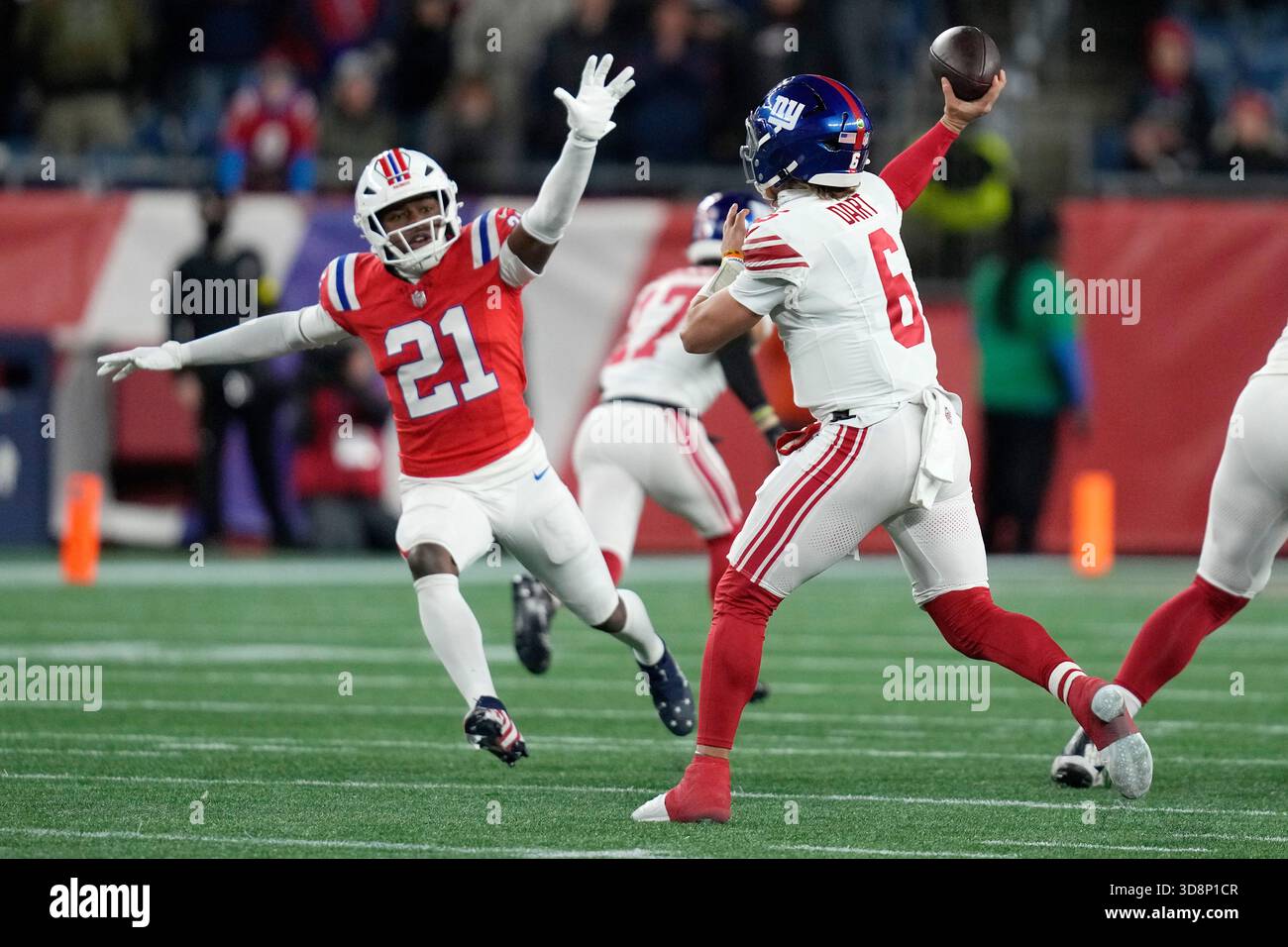 New York Giants quarterback Jaxson Dart (6) looks to throw while under ...