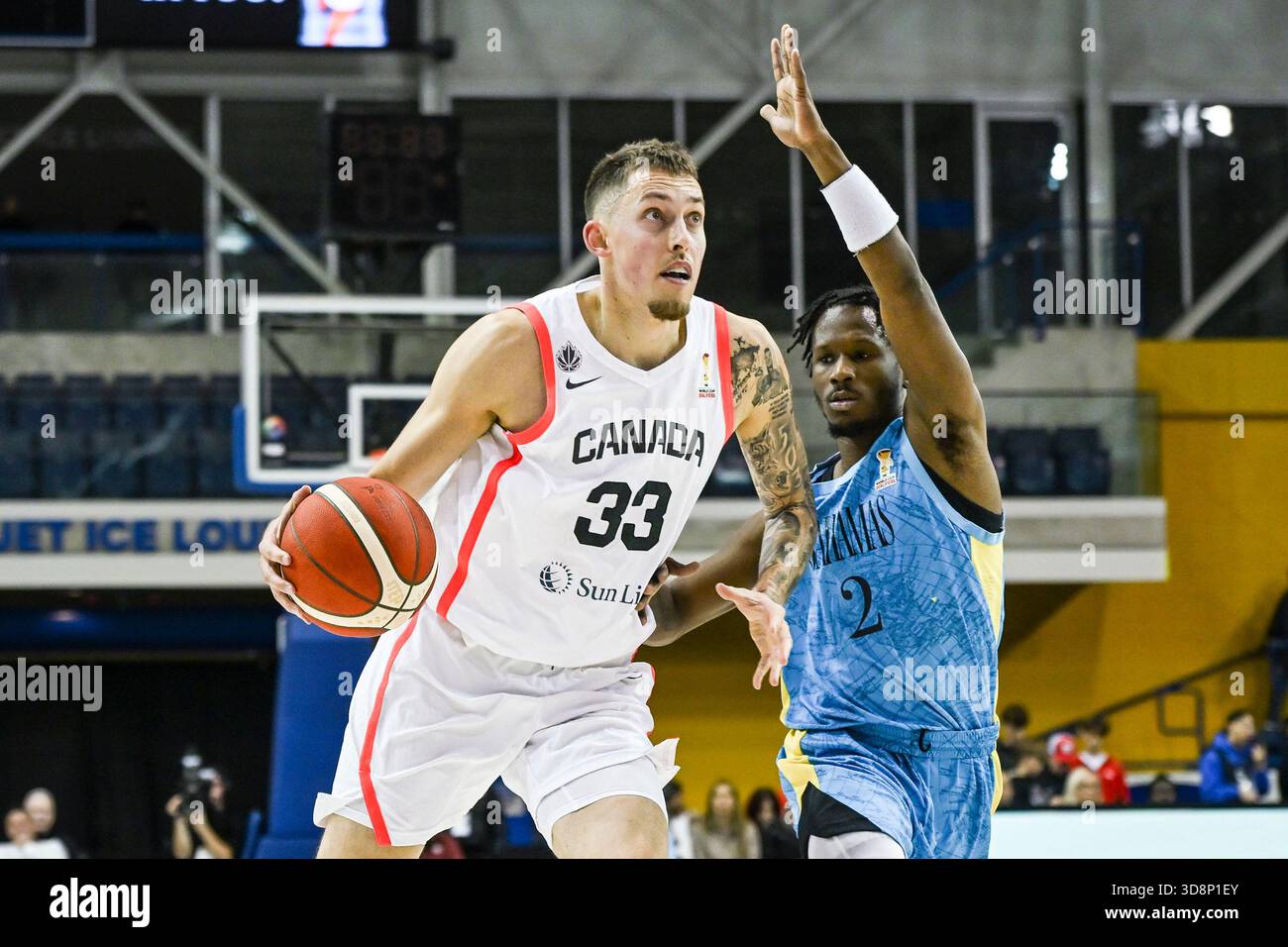 Canada's Kyle Wiltjer (33) moves up the court as Bahamas‚Äô Domnick ...
