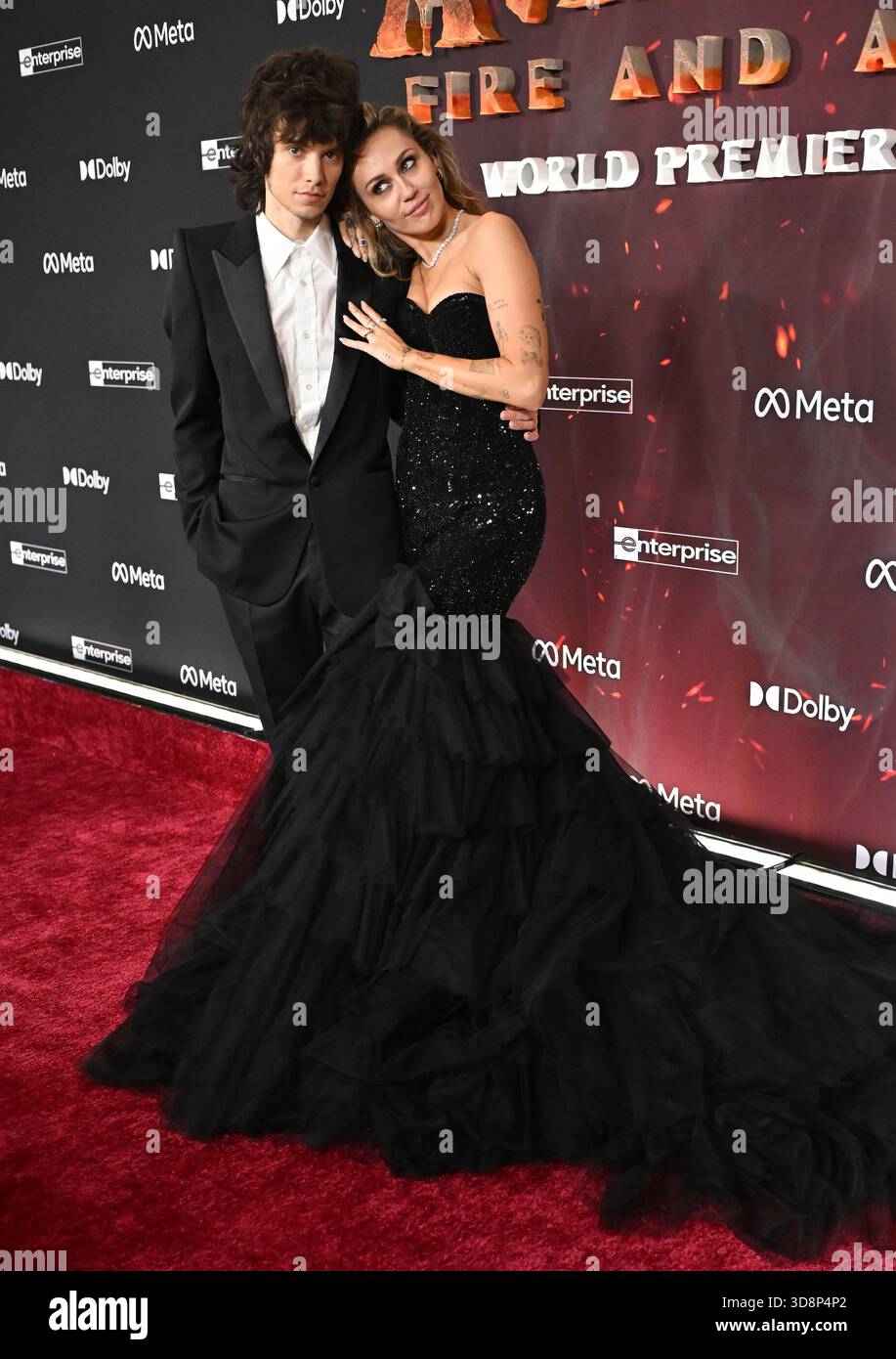 Hollywood, USA. 01st Dec, 2025. Miley Cyrus and Maxx Morando arriving ...