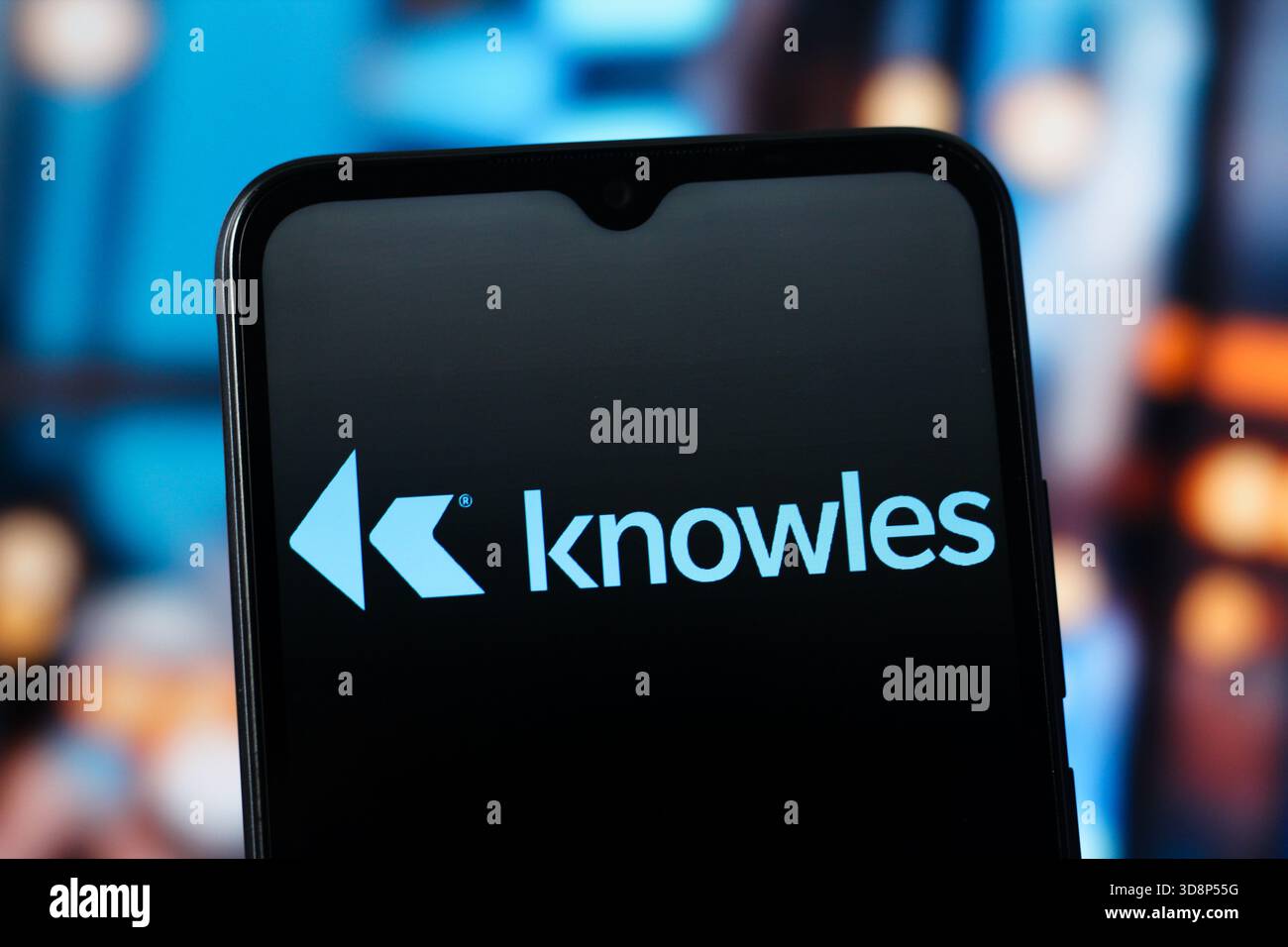 In this photo illustration, the Knowles logo is seen displayed on a ...