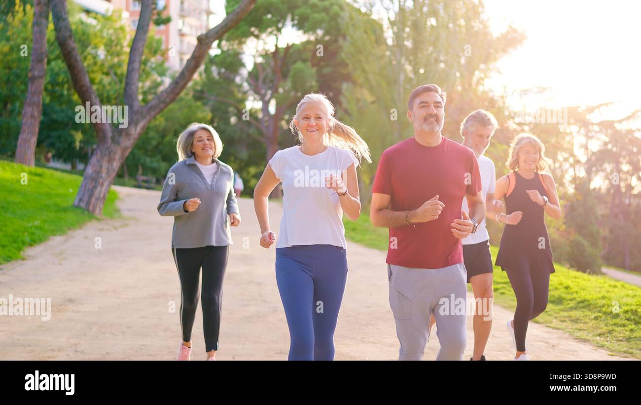 Group of friends jogging in a park hi-res stock photography and images ...