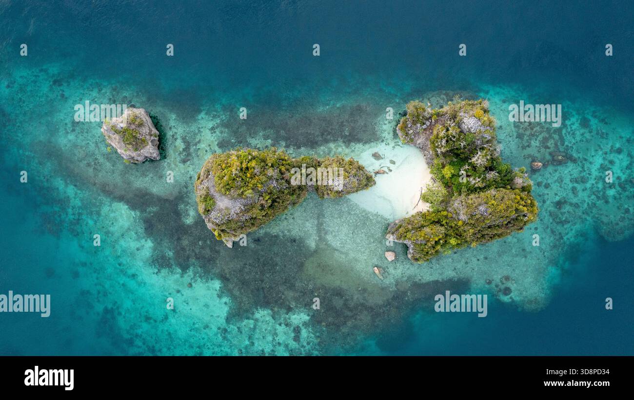 Aerial view of hidden lagoons and dense green trees growing on karst ...