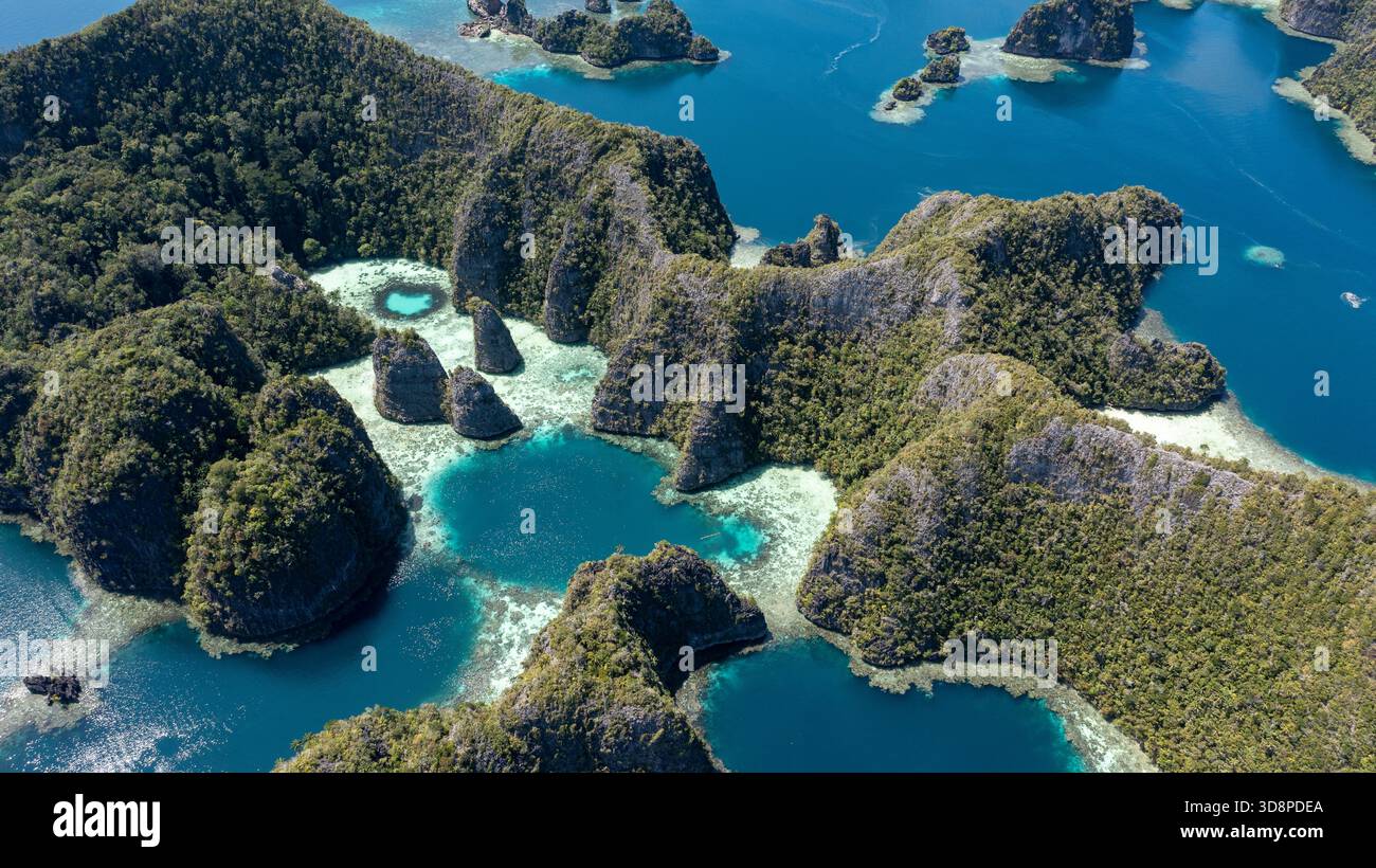Aerial view of the tall cliffs and karst islands of Balbulol lagoon ...