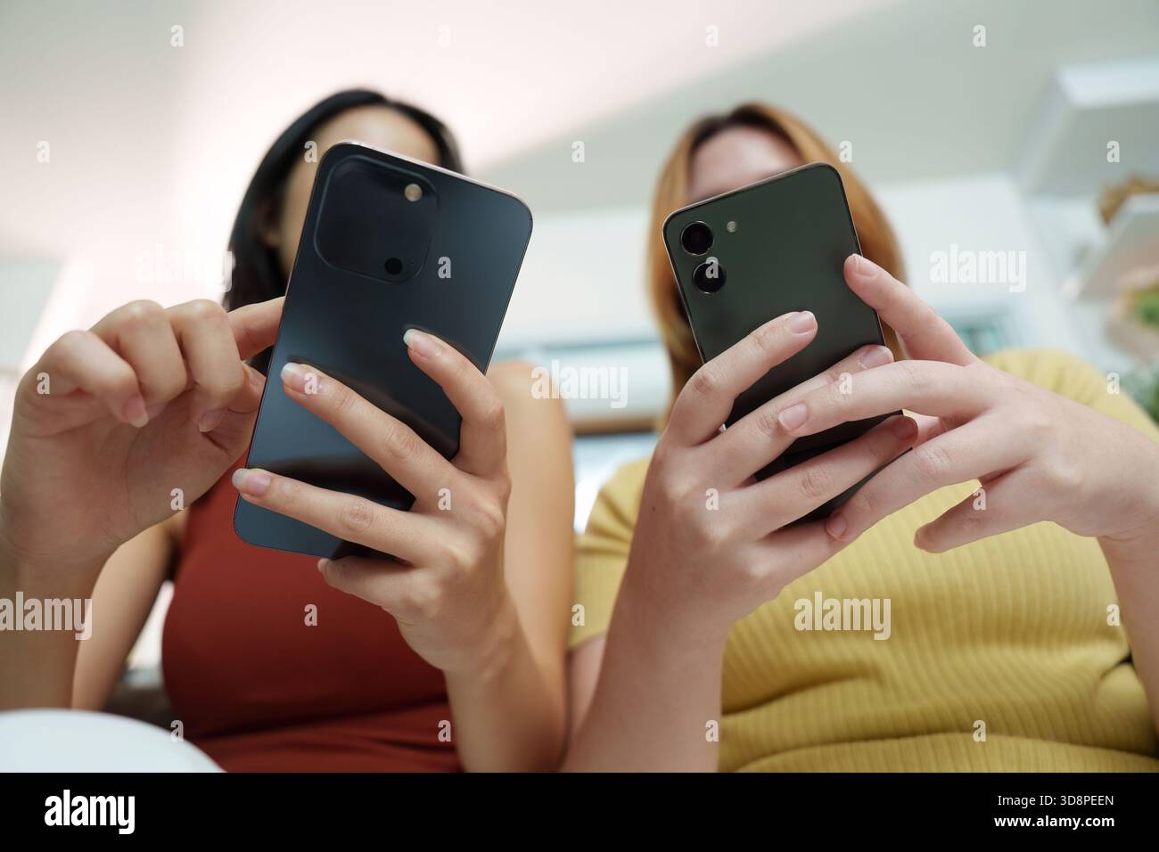 Social Media Engagement. Two friends using smartphones to connect and ...