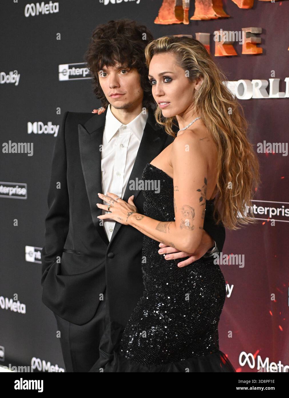 Miley Cyrus and Maxx Morando arriving to the world premiere of “Avatar ...