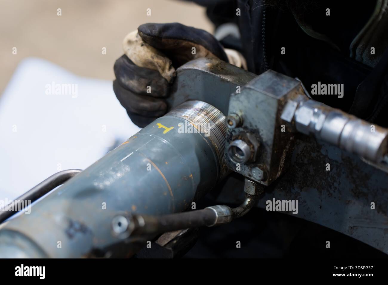 Worker performing detailed maintenance hi-res stock photography and ...