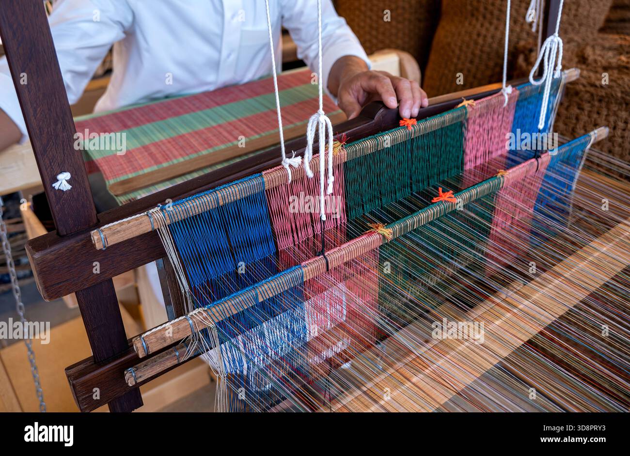 Doha, Qatar - December 01, 2025: Traditional hand-weaving in progress ...