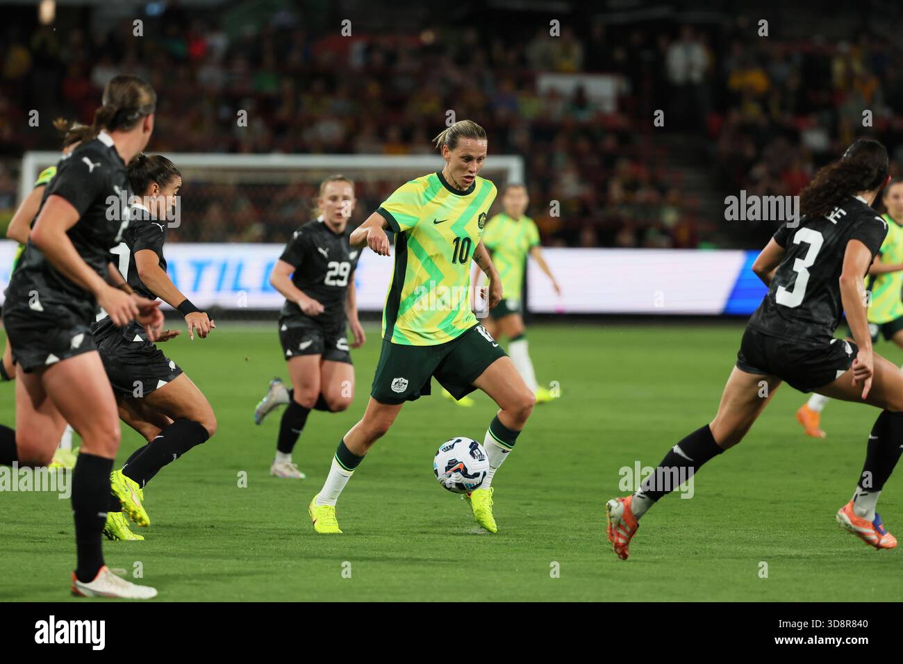 Australia's Emily van Egmond, center, carries the ball up to New ...