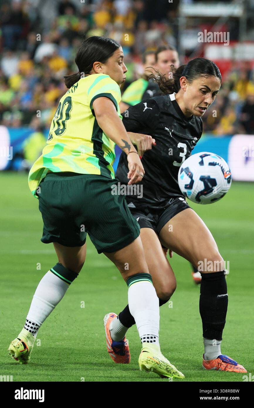 Australia's Sam Kerr, left, and New Zealand's Claudia Bunge compete for ...