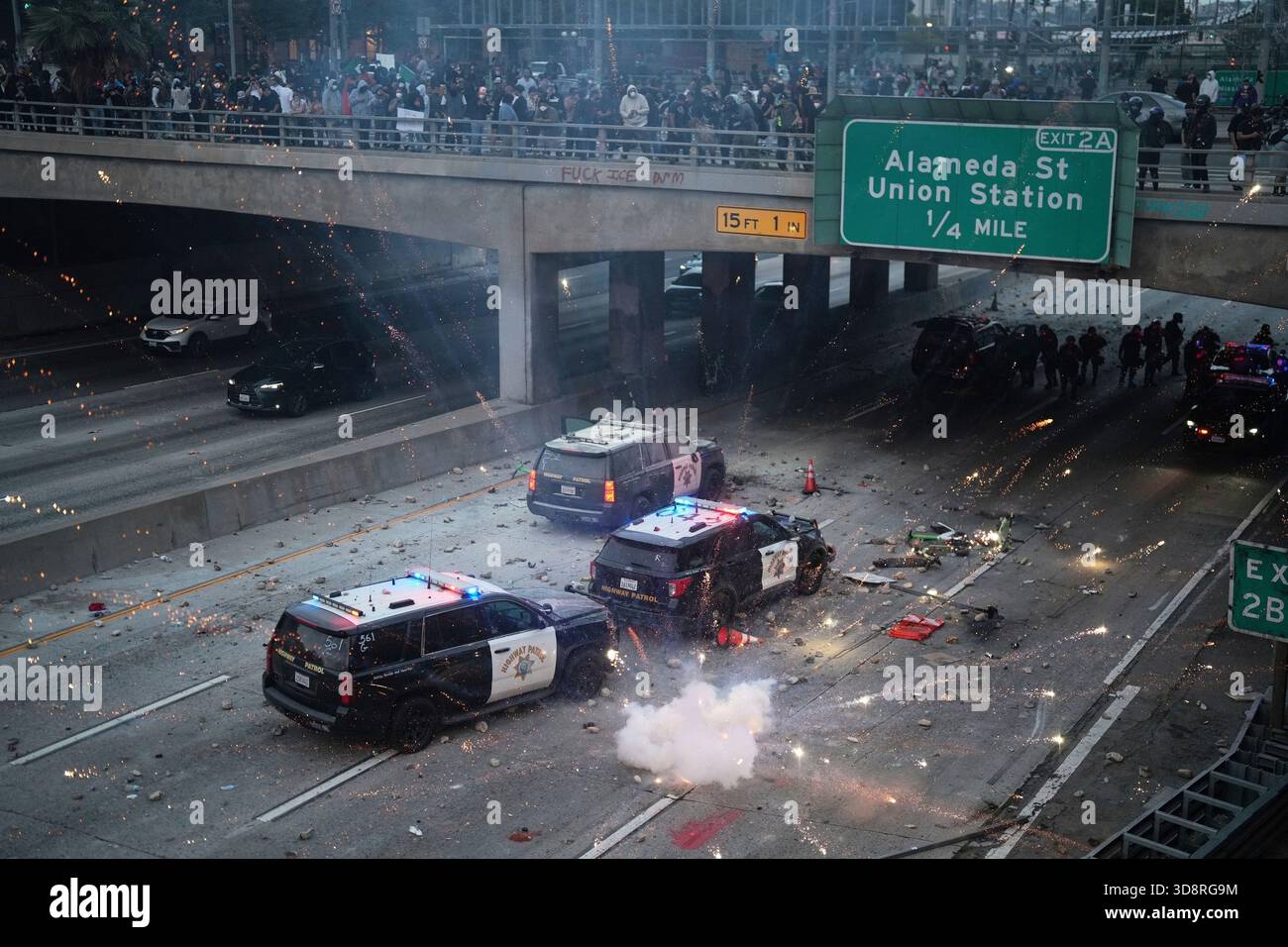 EDS NOTE: OBSCENITY A flash bomb explodes on the 101 Freeway near the ...