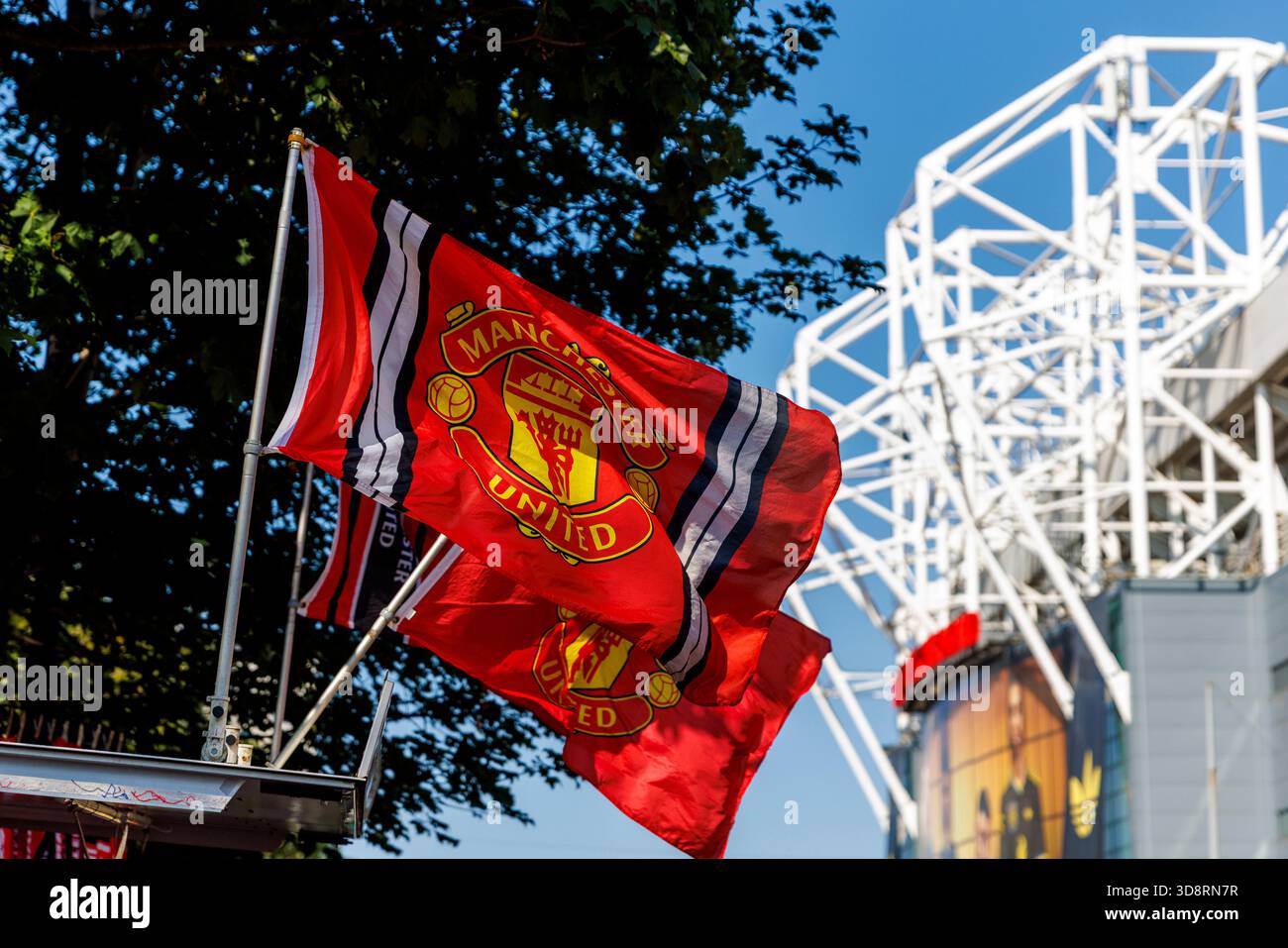 Manchester, England - 17.08.2025: Bright red football flags waving ...