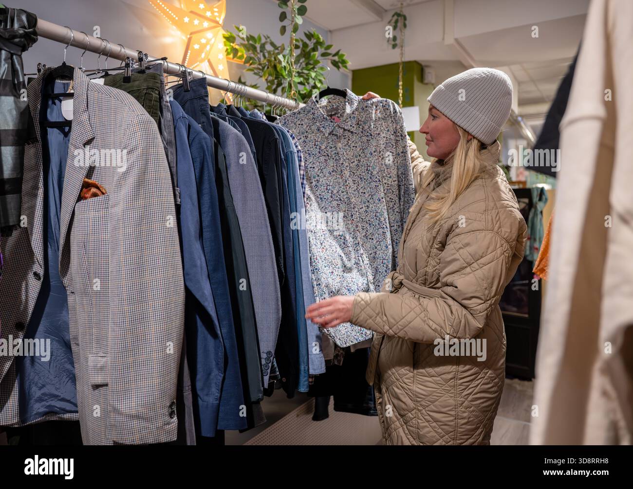 Customer in thrift shop browsing hi-res stock photography and images ...