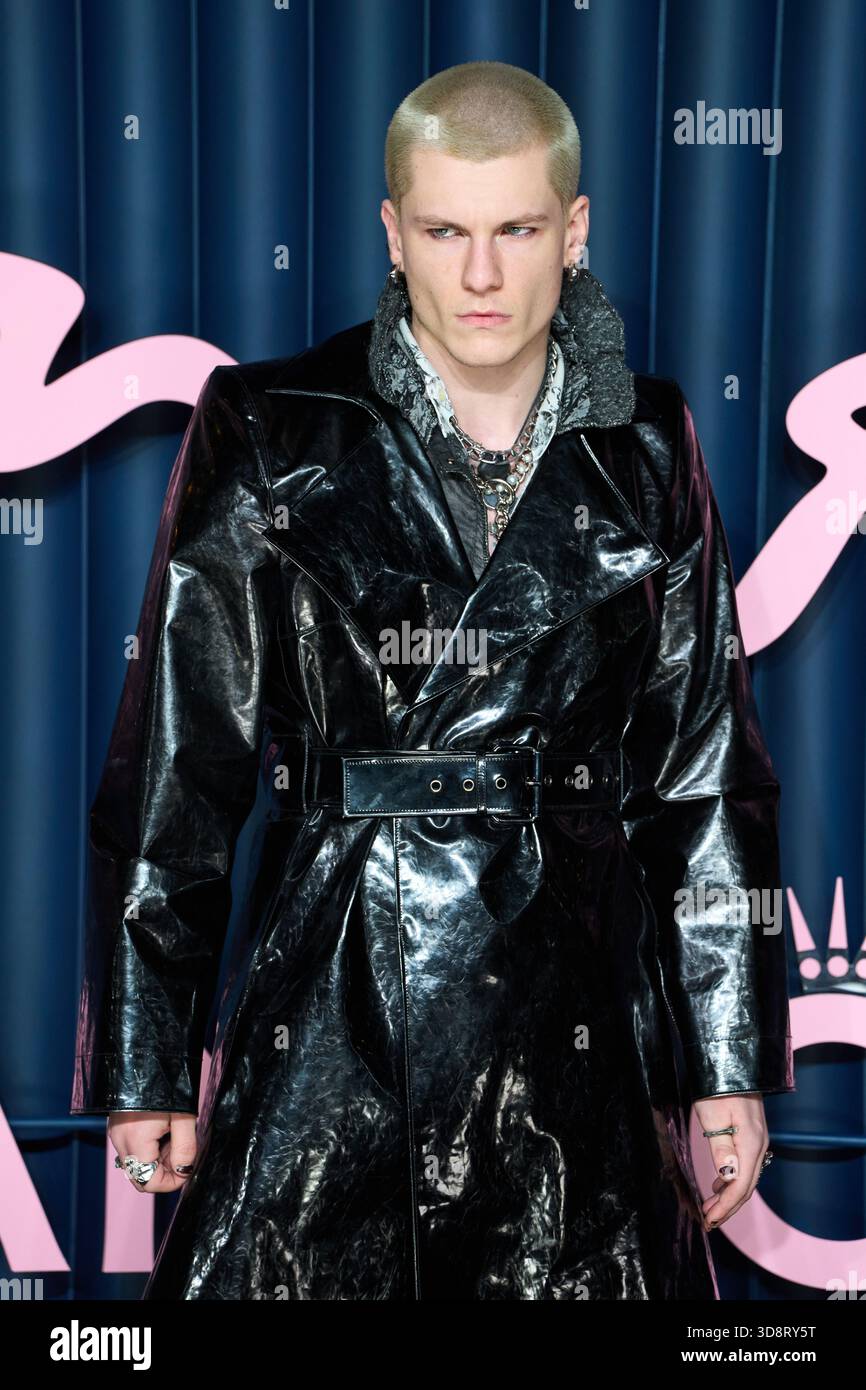 Aaron Adkins poses for photographers upon arrival at 'The Fashion ...