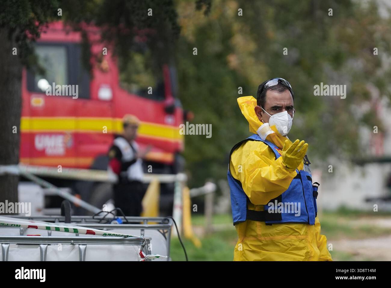 Several EMU personnel disinfect vehicles during the presentation of EMU ...