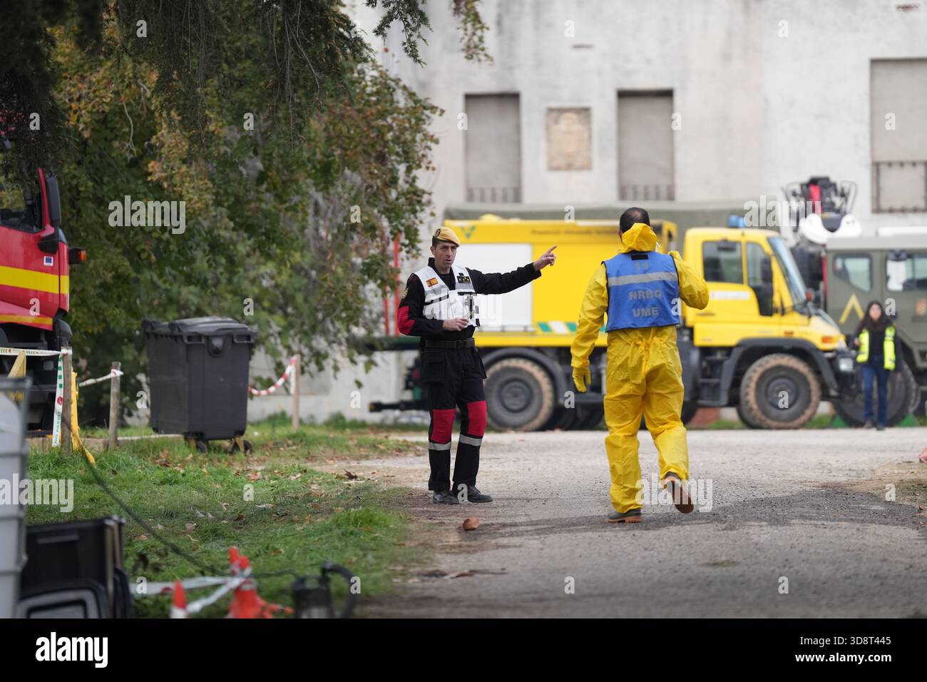 A member of the EMU disinfects vehicles during the presentation of the ...