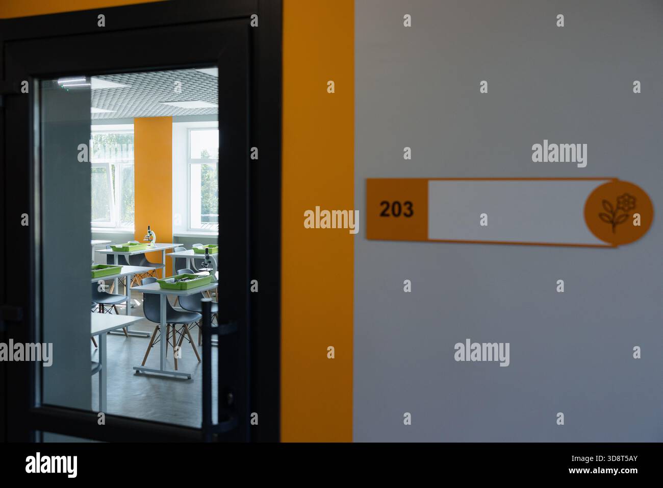 Entering a colorful classroom filled with modern furnishings, natural ...