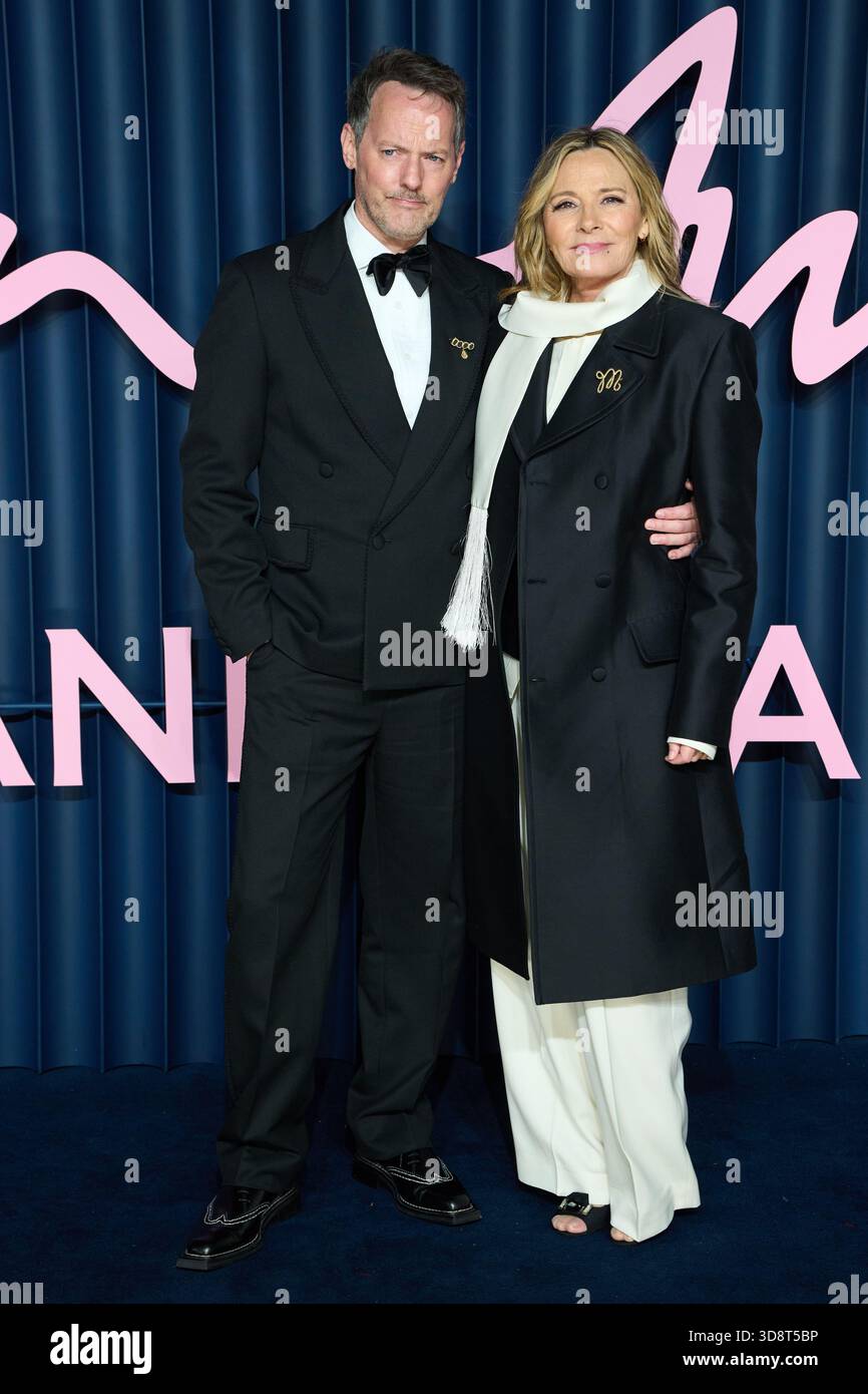 Russell Thomas, left, and Kim Cattrall pose for photographers upon ...