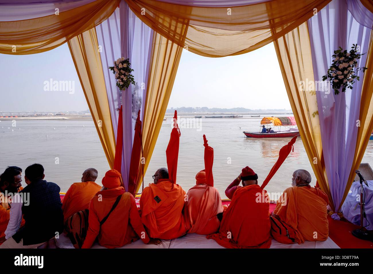 Indian sadhus participate in a ritual prayer at Sangam, the confluence ...