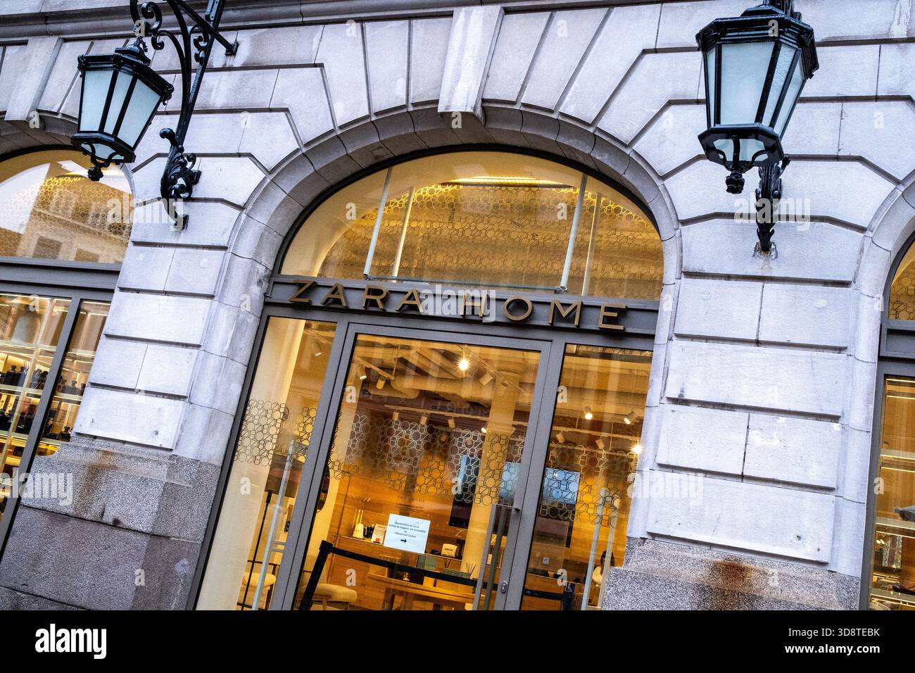 Front view of the Zara Home storefront with illuminated interior ...