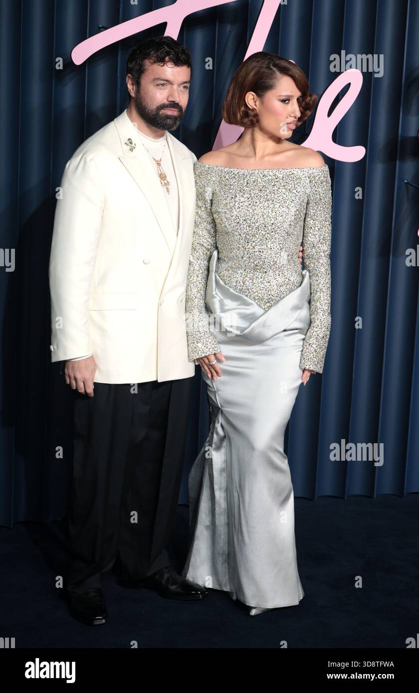 London, UK, 1st December 2025, Rocco Iannone and Raye posing on the red ...