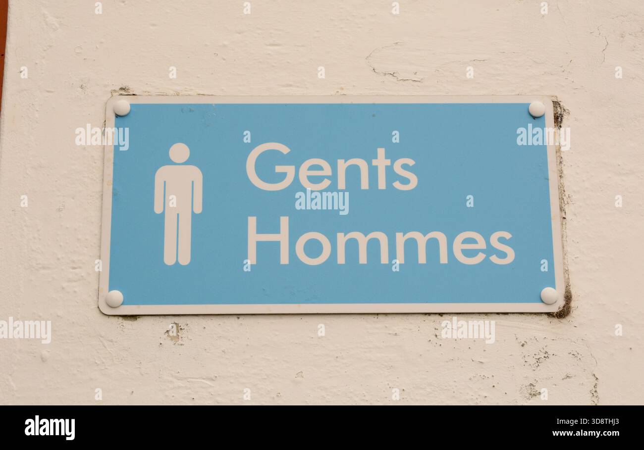 Gents Hommes sign at a public toilet in Jersey, The Channel Islands ...