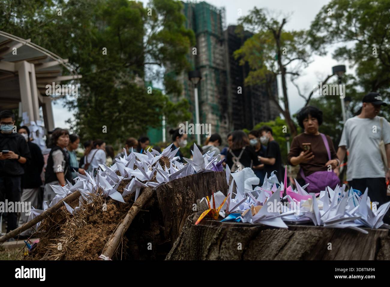 origami crane at a makeshift memorial near Wang Fuk Court housing ...