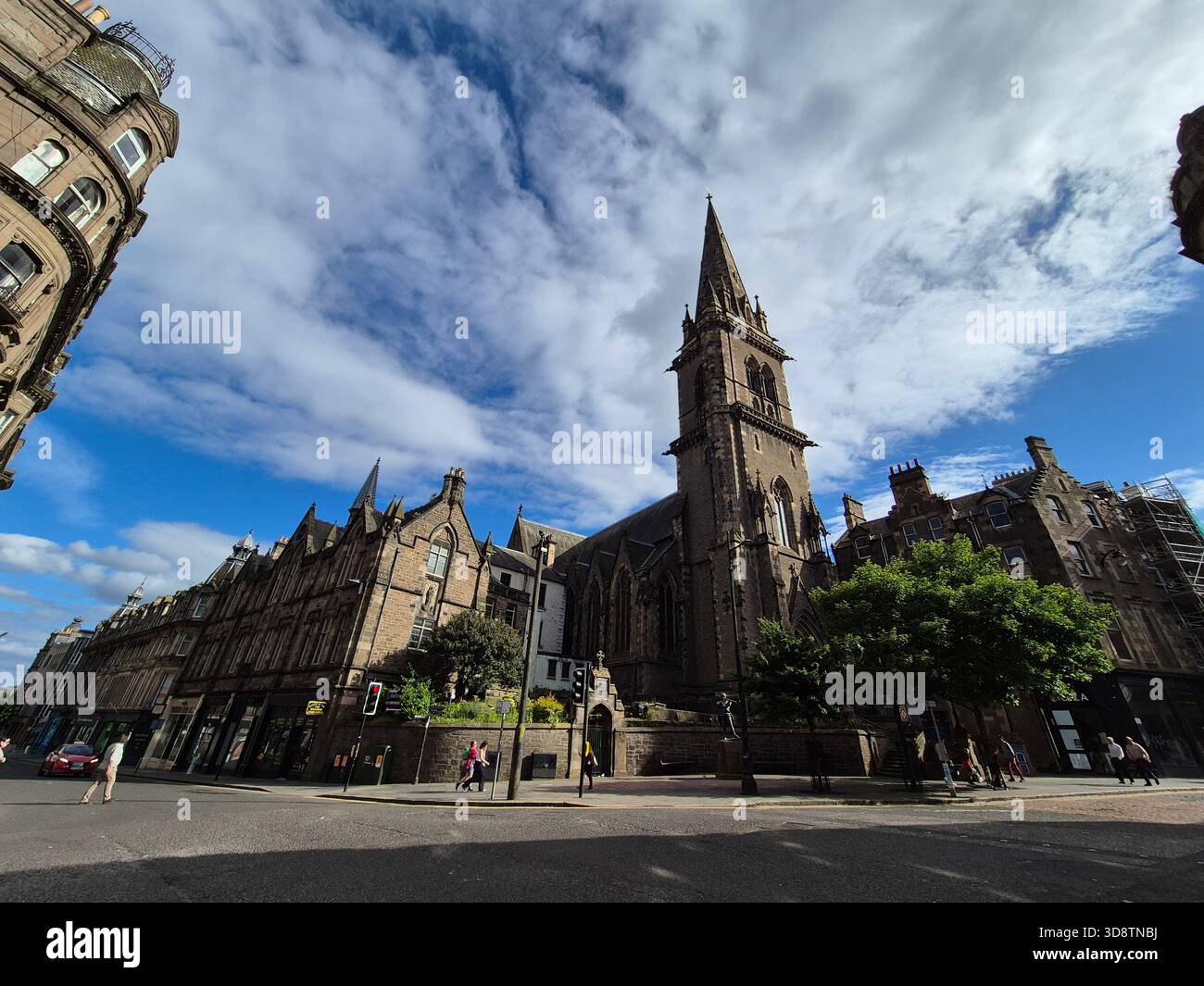 Old historic buildings at a street of Dundee, Scotland. On the right ...