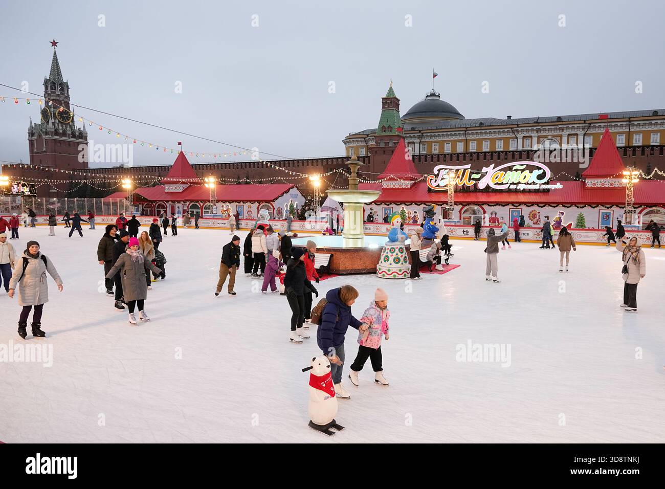 People skate on an ice rink installed at the Red Square in Moscow ...