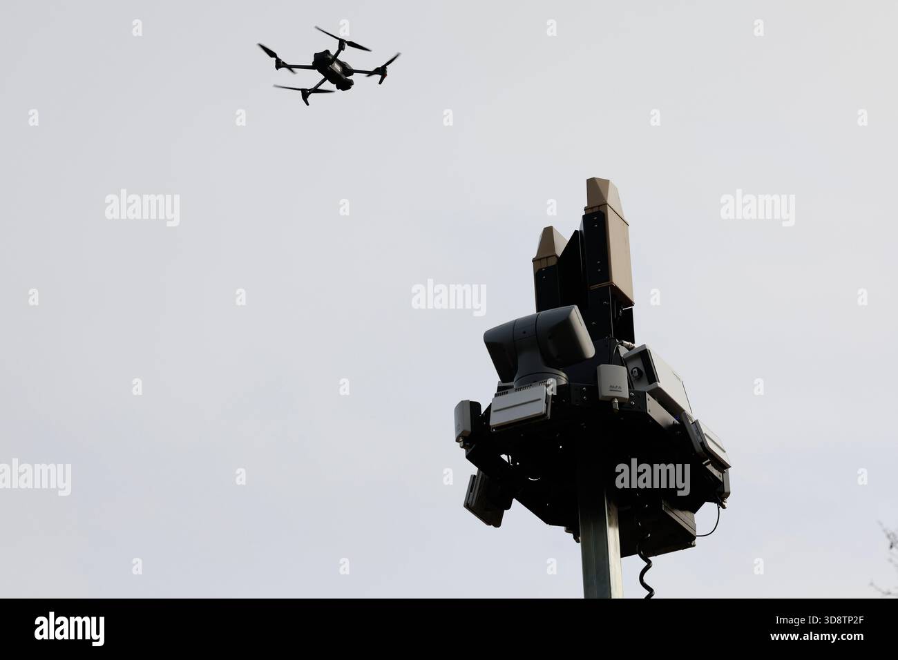 A drone flies over during a demonstration of a mobile counter drone ...