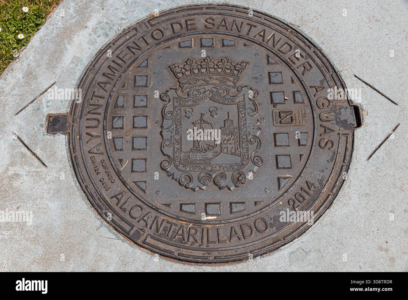 Santander, Spain. Metal manhole cover showing the city coat of arms ...