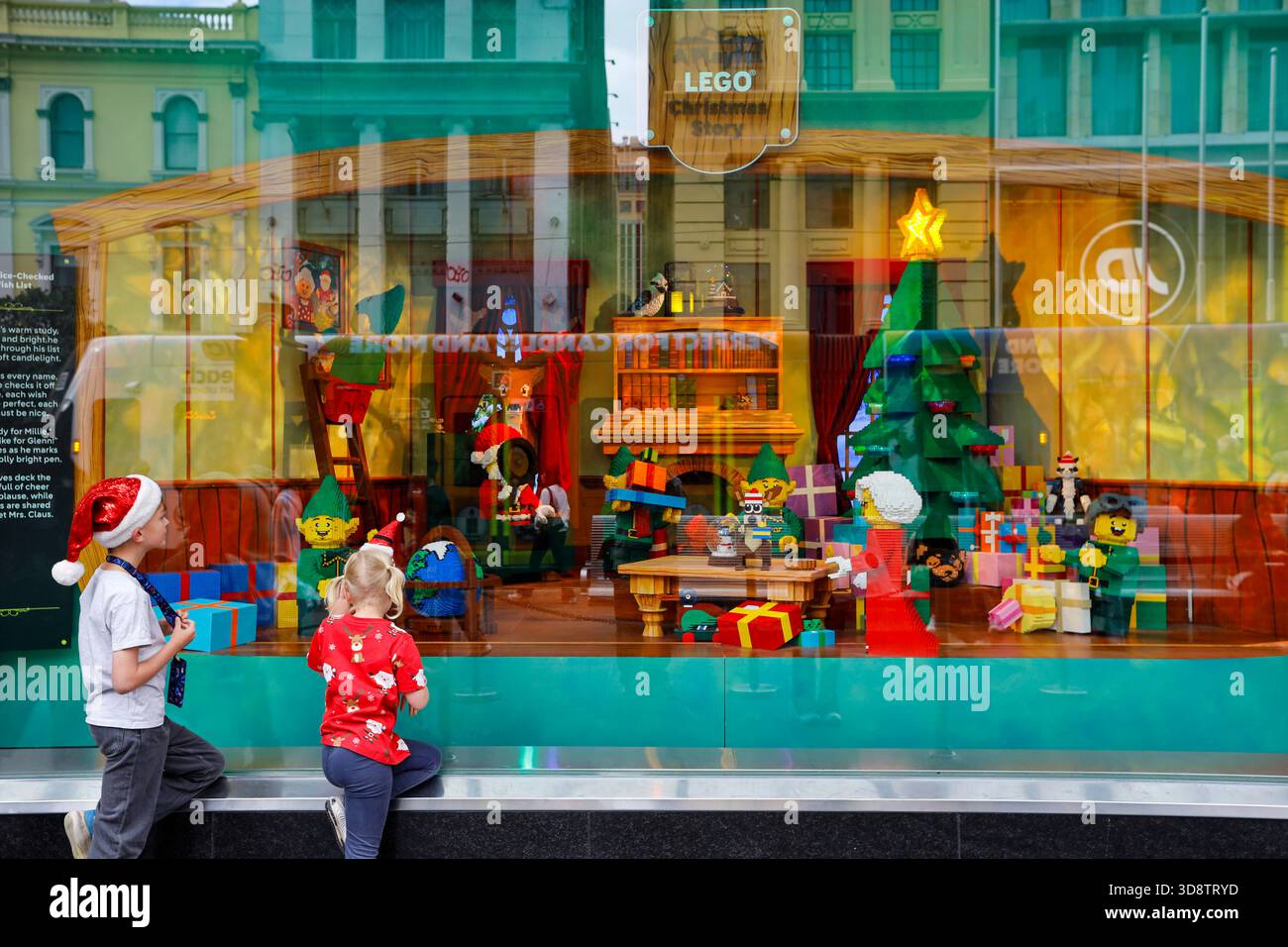 Visitors gather to view the Myer Christmas decoration window. Melbourne ...